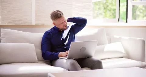 Man Working On Laptop Computer With Neck... | Stock Video | Pond5