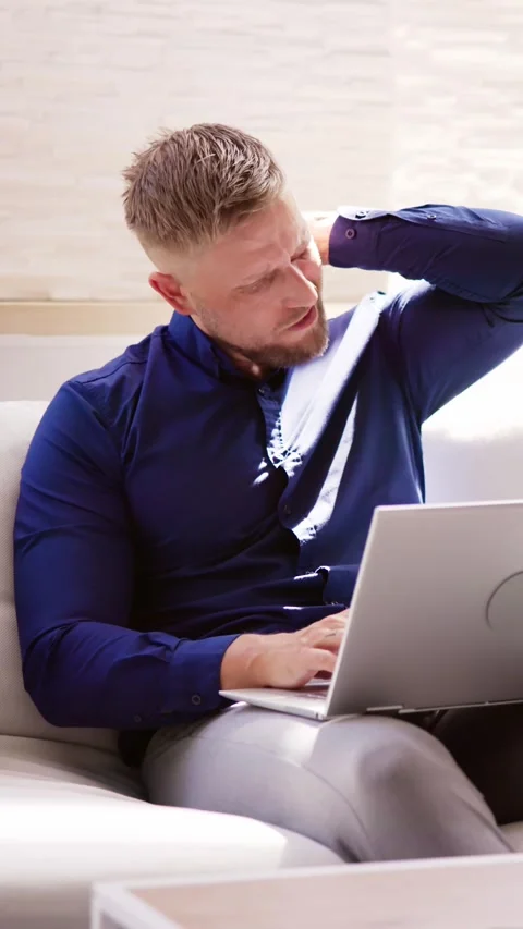 Man Working On Laptop Computer With Neck... | Stock Video | Pond5