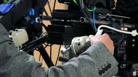 Man works with camera at tripod and adju... | Stock Video | Pond5