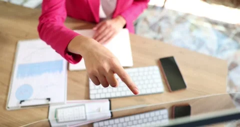 Manager pointing finger at charts on com... | Stock Video | Pond5