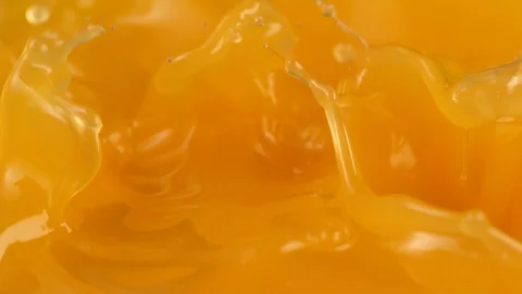 Mango chunks falling into mango juice in... | Stock Video | Pond5