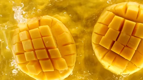 Mango falling and splashing into water o... | Stock Video | Pond5