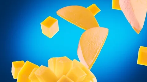 Mango with Slices Falling on Blue Backgr... | Stock Video | Pond5