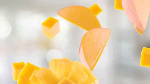 Mango with Slices Falling on Kitchen Bac... | Stock Video | Pond5