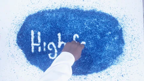 Man's arm writing in the blue particles ... | Stock Video | Pond5