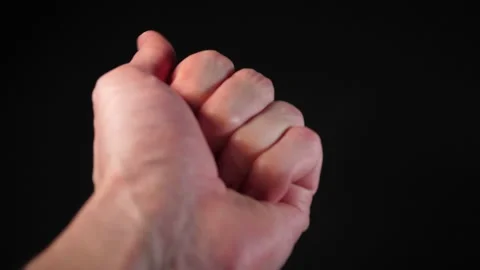 A man's hand begging on a black backgrou... | Stock Video | Pond5