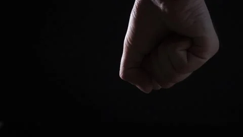 a man's hand clenches into a fist in rag... | Stock Video | Pond5