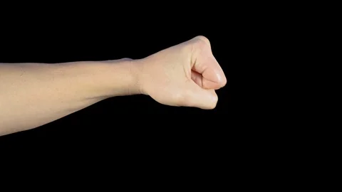 Man's hand with closed fist isolated on ... | Stock Video | Pond5