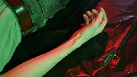 mans hand falls to the black plastic flo... | Stock Video | Pond5