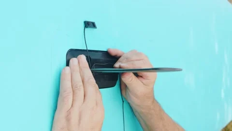 The man's hand inserts and removes the f... | Stock Video | Pond5