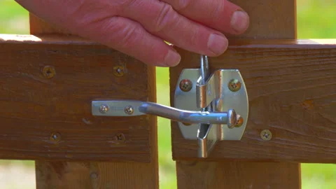 Man's hand opening and closing the latch... | Stock Video | Pond5