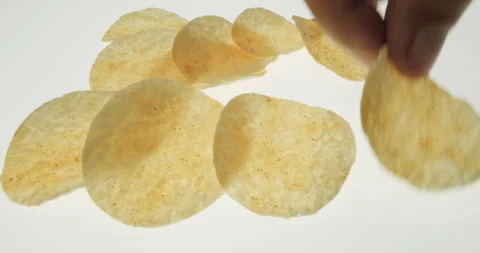 Mans hand is picking potato chips. Potat... | Stock Video | Pond5