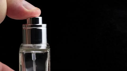The man's hand presses on the perfume di... | Stock Video | Pond5