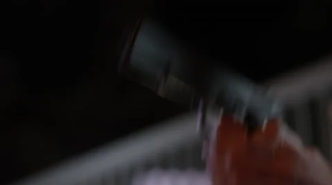 Man's hand pulling trigger of gun while ... | Stock Video | Pond5