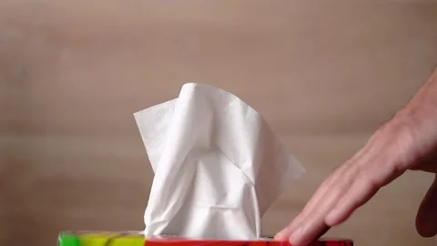 Man's hand pulls paper tissues out of a ... | Stock Video | Pond5