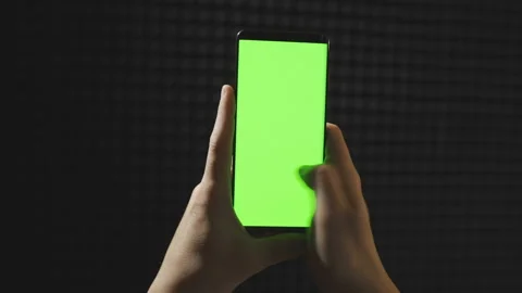 Man's hand scrolling smartphone with gre... | Stock Video | Pond5