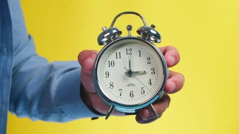 Man's hand shows the time 3 o'clock on a... | Stock Video | Pond5