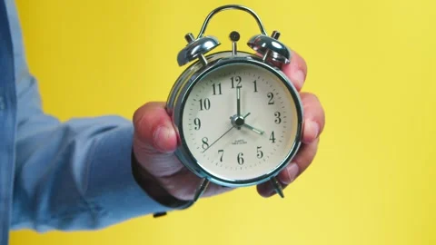 Man's hand shows the time 4 o'clock on a... | Stock Video | Pond5