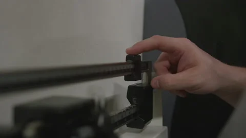 A Man's Hand Sliding Across a Scale | Stock Video | Pond5