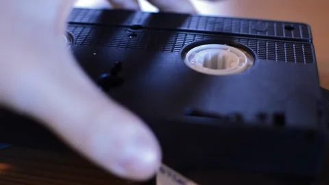 man's hand take vhs film tape for movie.... | Stock Video | Pond5