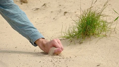 Man's hand touching the sand in the dese... | Stock Video | Pond5