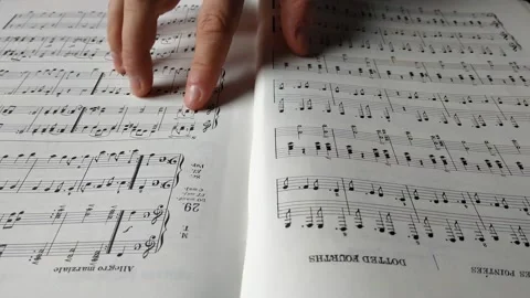 man's hand turn music book's page. class... | Stock Video | Pond5