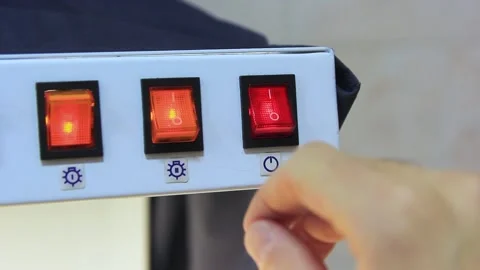 A man's hand turns on and off the button... | Stock Video | Pond5