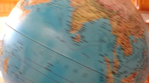 man's hand using a world globe map. spin... | Stock Video | Pond5