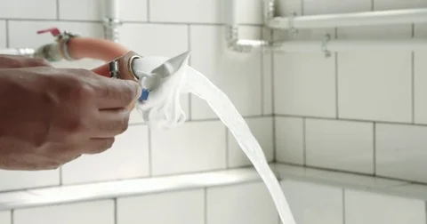 man's hand washing a razor with water in... | Stock Video | Pond5
