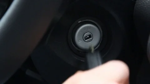 Man's hands turning the ignition key in ... | Stock Video | Pond5
