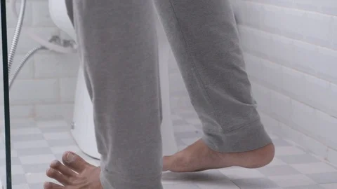 man's pull his pants down and sitting on... | Stock Video | Pond5