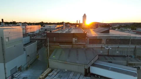 Manufacturing plant at sunset. Aerial fl... | Stock Video | Pond5