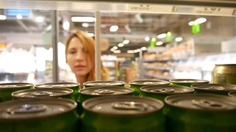 Many cans of soda in a supermarket fridg... | Stock Video | Pond5