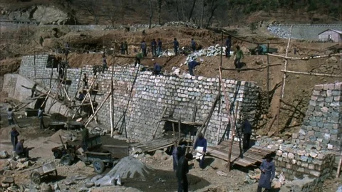 Many Chinese workers busy around partial... | Stock Video | Pond5