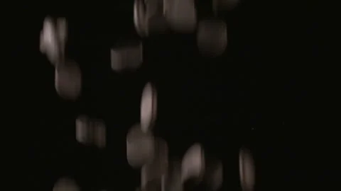 Many chocolate chips falling down, shot ... | Stock Video | Pond5