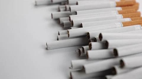 Many cigarettes on a white background. A... | Stock Video | Pond5