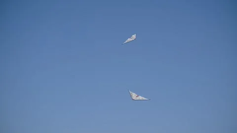 Many kites are flying high in the blue s... | Stock Video | Pond5