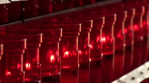 Many memory candles burning in church | Stock Video | Pond5