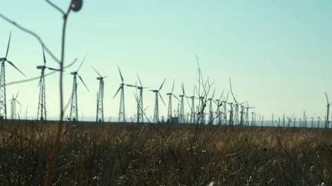 Many old wind turbine generators on gree... | Stock Video | Pond5