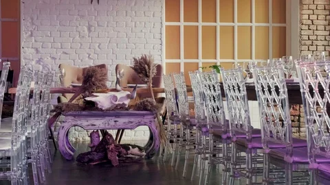 Many transparent chairs stand in two row... | Stock Video | Pond5