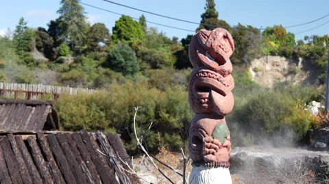 Maori statue with geyser at the backgrou... | Stock Video | Pond5