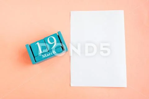 March 19. Blue cube calendar with month and date and white mockup blank ...