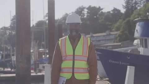 A Marina Worker Wearing a Hard Hat, Jack... | Stock Video | Pond5