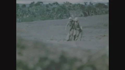 Marine tank driver assisted back to firs... | Stock Video | Pond5