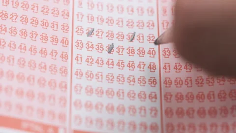 Marking Numbers on Lottery Ticket | Stock Video | Pond5