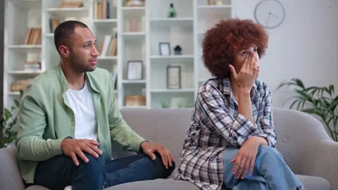 Married couple having argument on grey c... | Stock Video | Pond5