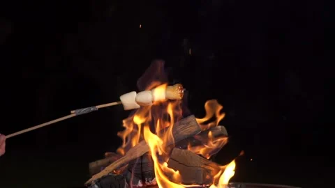 Marshmallows On A Stick Roasting Over Ca... | Stock Video | Pond5