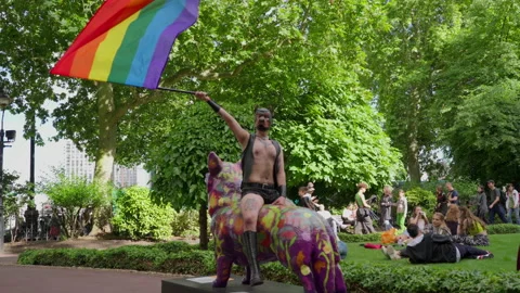 Masked Man Sitting on Sculpture Waves Ra... | Stock Video | Pond5