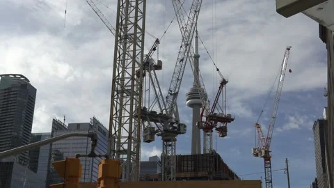 Massive condo construction cranes dwarf ... | Stock Video | Pond5