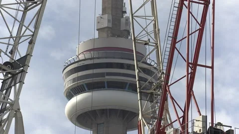 Massive condo construction cranes dwarf ... | Stock Video | Pond5